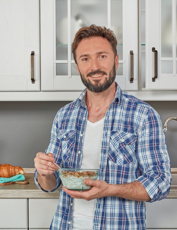 Healthy man eating cereal stock image. Image of media - 127505107