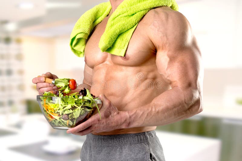 Healthy man eating a salad stock image. Image of bodybuilder - 90793713