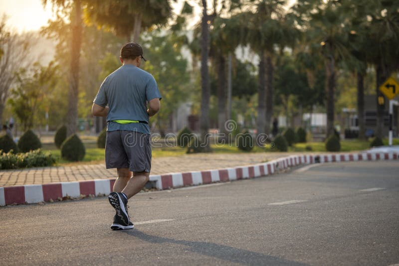 Healthy Mature Man Jogging at Evening Editorial Stock Image - Image of ...