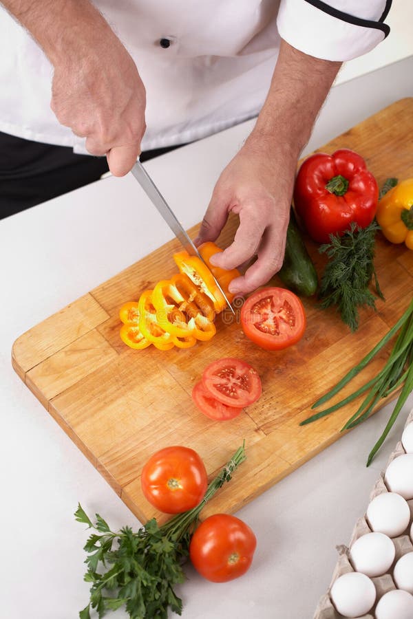 Chef adding ingredients stock image. Image of corn, hand - 25469623