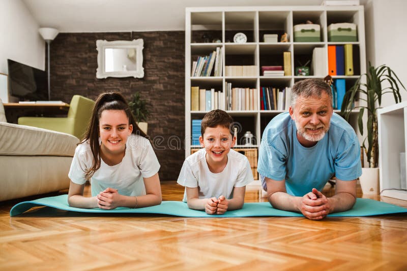 Morning Stretching - Family Doing Gymnastic Exercise at Home Stock ...