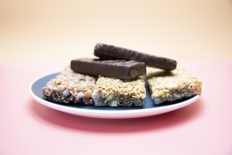 Healthy Nutrition Protein Bars on Pink and Orange Background Stock ...