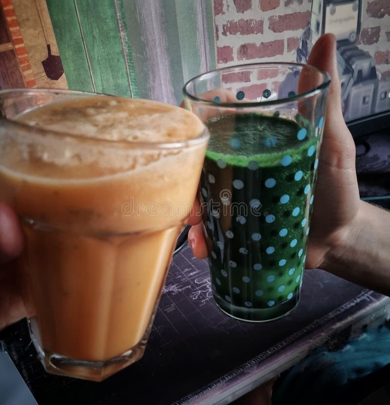 Healthy shakes in hands stock photo. Image of orange - 312309642