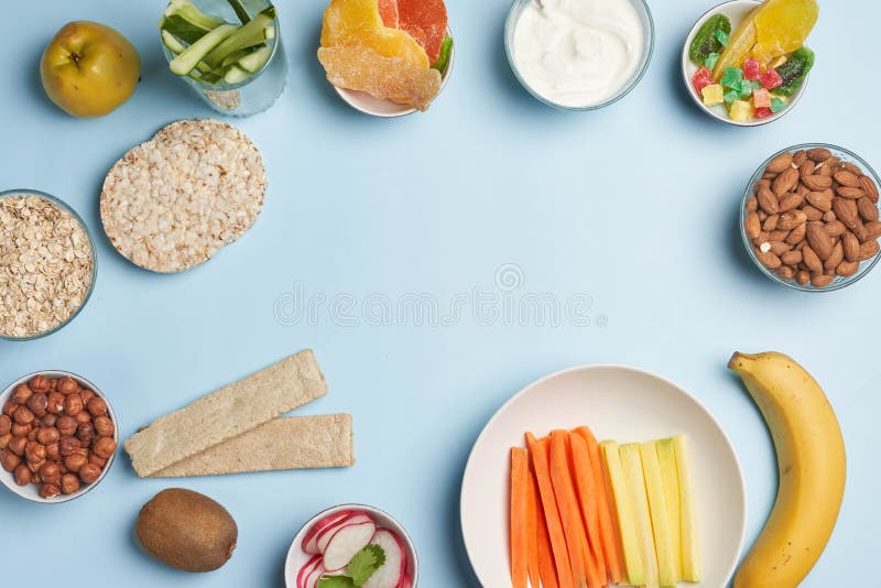 Healthy Snacks on Bright-colored Table with Copy Space Stock Photo ...