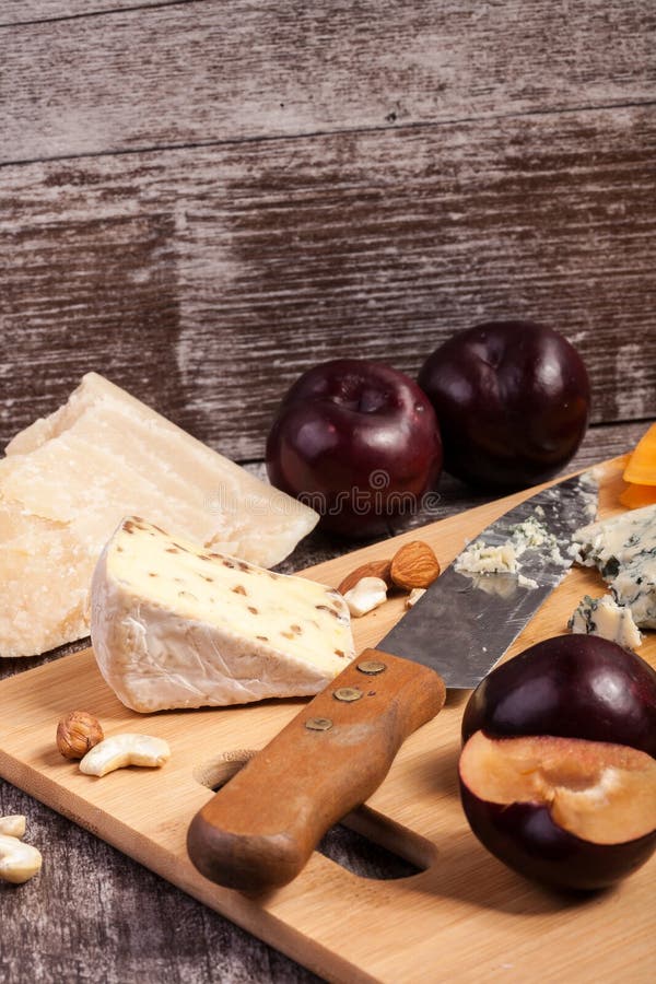 Healthy Snaks from Different Type of Cheese, Nuts and Plums Stock Photo ...