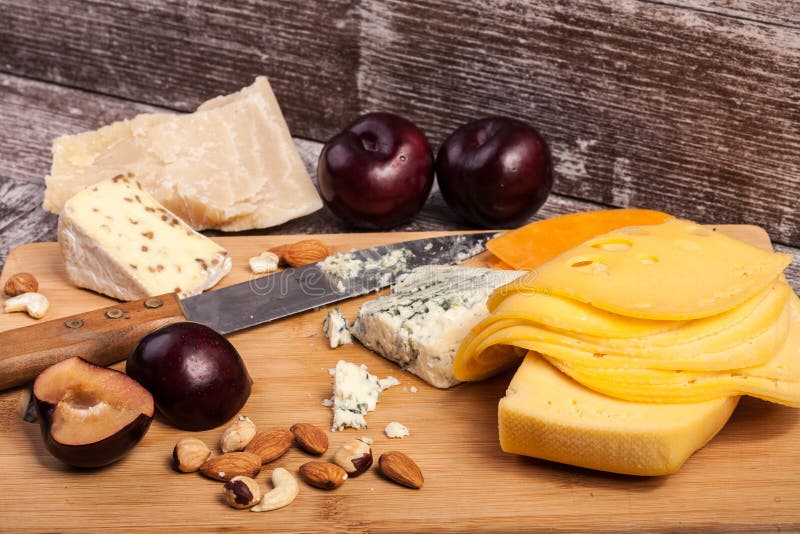 Healthy Snaks from Different Type of Cheese, Nuts and Plums Stock Image ...