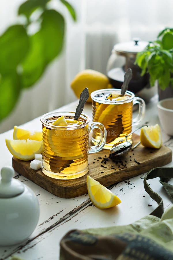 Healthy Tea with Lemon in Cups on the Table Stock Photo - Image of food ...