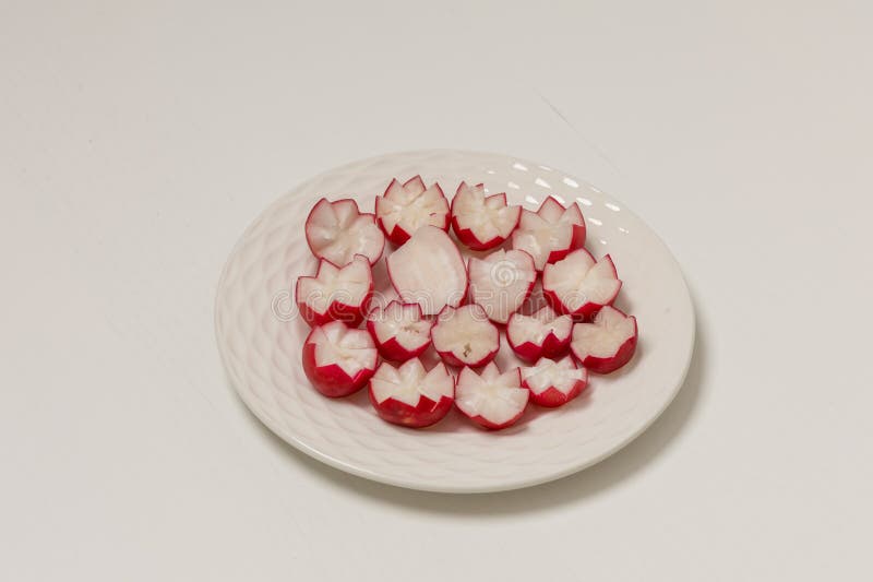 Healthy Vegetables. Radishes Cut in Half on a White Plate Stock Image ...
