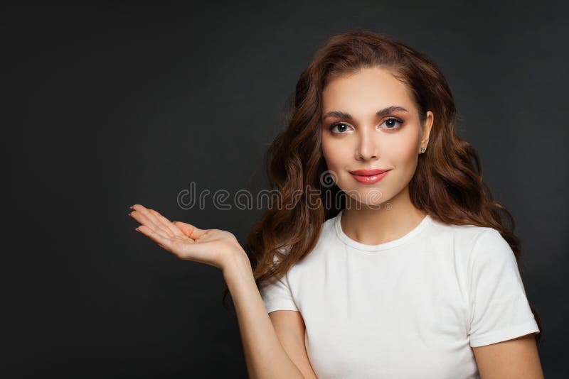 Healthy Woman with Empty Open Hand on Dark Background Stock Image ...