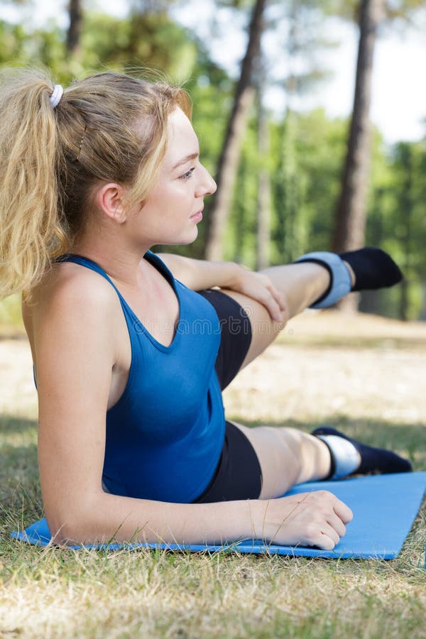Healthy Woman Side Leg Raises Workou Stock Image - Image of beach ...