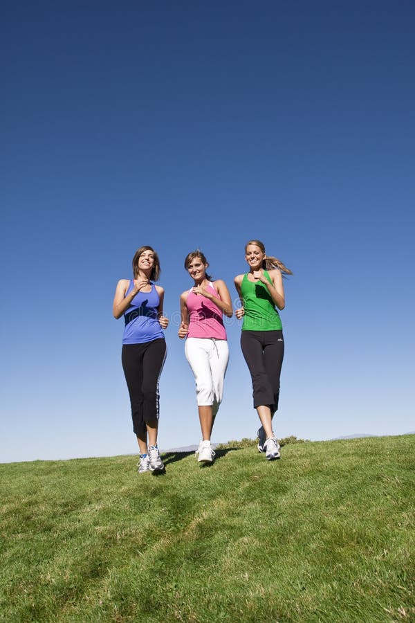 Healthy Women Jogging Together Stock Image - Image of smiling, together ...