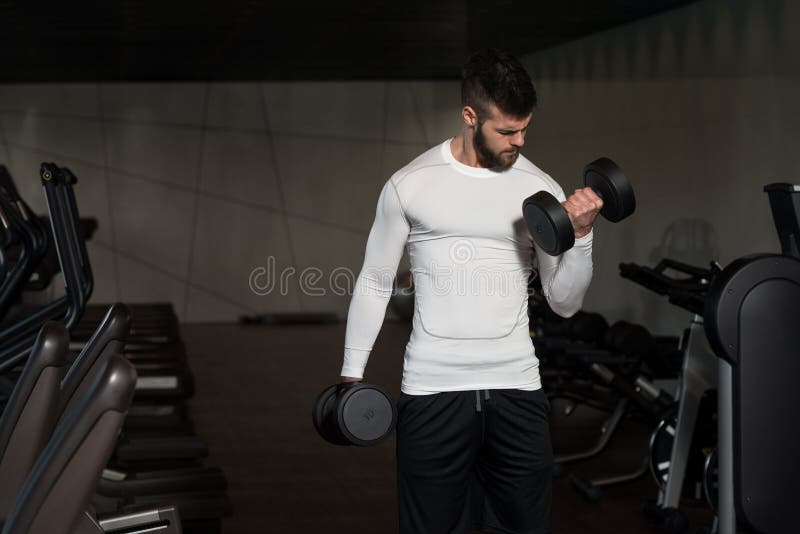 Healthy Young Man Doing Exercise for Biceps Stock Photo - Image of ...