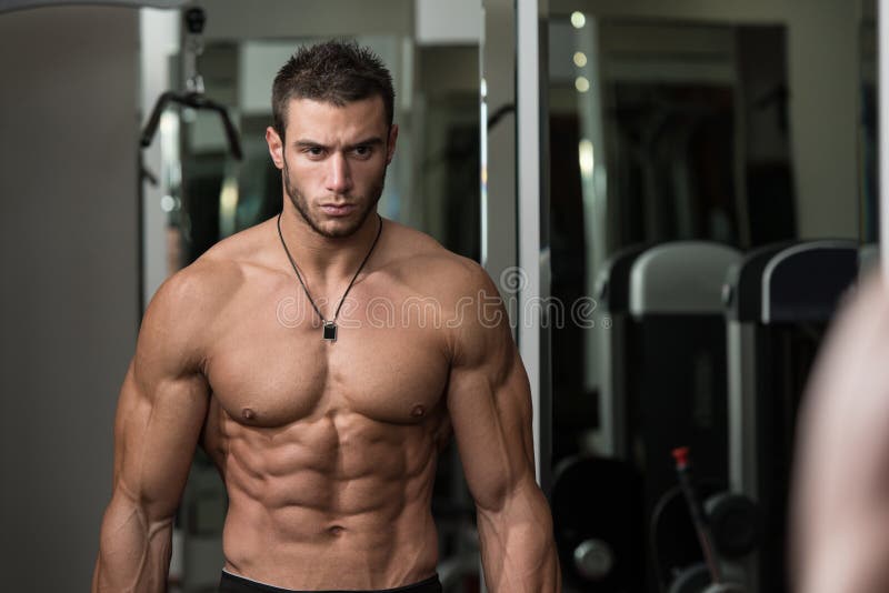 Healthy Young Man Doing Exercise for Biceps Stock Photo - Image of ...