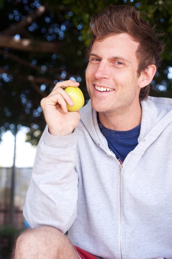 Portrait of a Young Healthy Man Holding Apple Stock Image - Image of ...