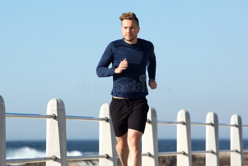 Healthy Young Man Jogging Outside Stock Image - Image of outdoor ...