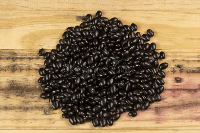 Heap of Black Beans Scattered Over Rustic Wood Stock Image - Image of ...