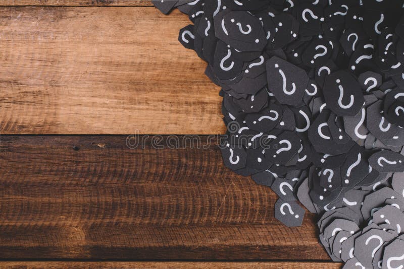 Heap of Black Paper with QUESTION MARK on Wooden Table Stock Image ...