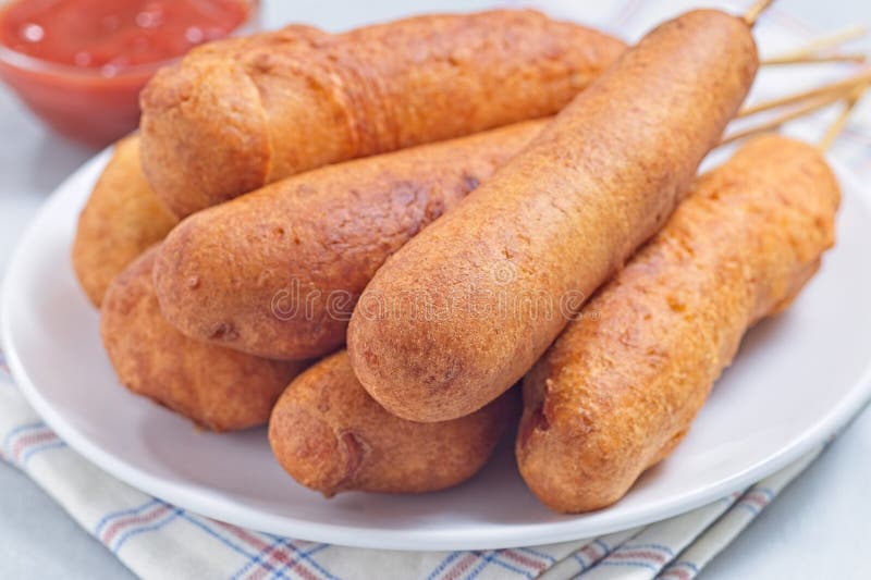 Heap of Corn Dogs on White Plate, Served with Ketchup, Horizontal Stock ...