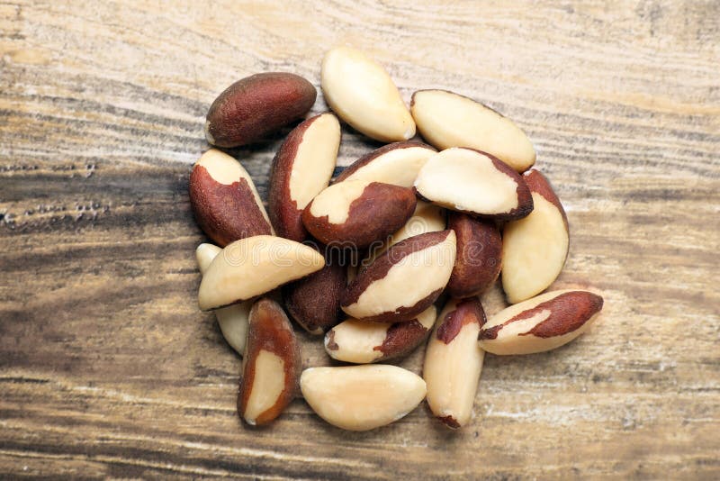 Heap of Delicious Brazil Nuts on Wooden Table, Top View Stock Photo ...
