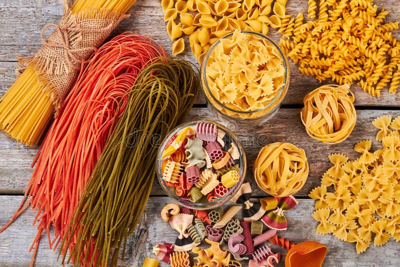 Heap of Different Pasta in the Old Background. Stock Photo - Image of ...