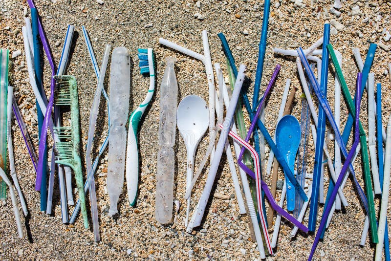 Heap of Different Plastic Waste on Sand Background Stock Photo - Image ...