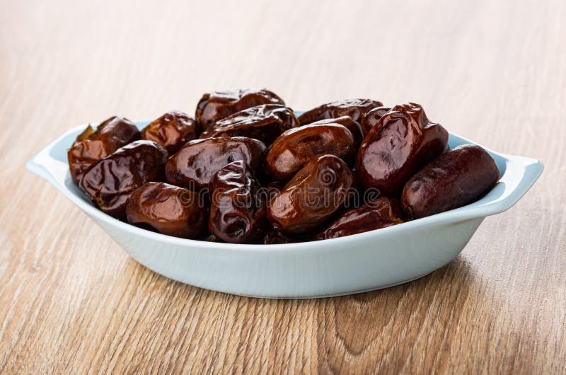 Heap of Dried Dates in Blue Bowl on Table Stock Image - Image of sweet ...