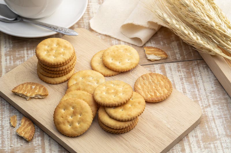 Heap of Dry Thin Crispy Crackers on Cutting Board Stock Photo - Image ...
