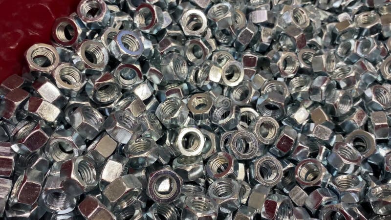 Heap of Fasteners with a Threaded Hole, Close Up. a Lot of Hexagonal ...