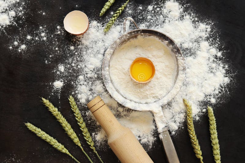 Heap of Flour on Dark Table, Items for Dough Preparation. Flat Lay ...