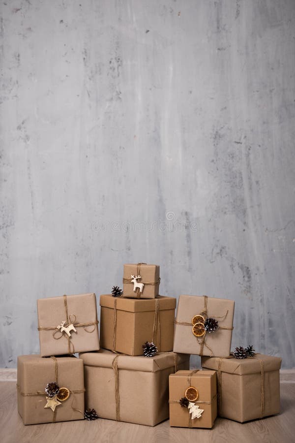 Heap of Gift Boxes and Copy Space Over Grey Concrete Wall Stock Photo ...