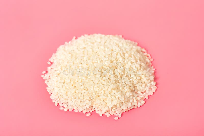 Heap of Grain of Rice on Pink Background Stock Image - Image of ...
