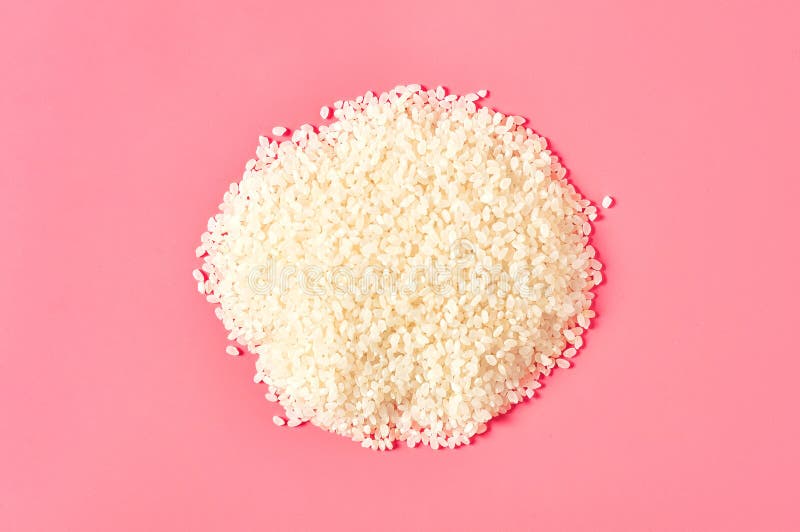 Heap of Grain of White Rice on Pink Background Stock Photo - Image of ...