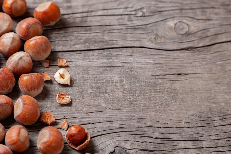 Heap Hazel and Two Nuts with Broken Shell on Old Wooden Table. Copy ...