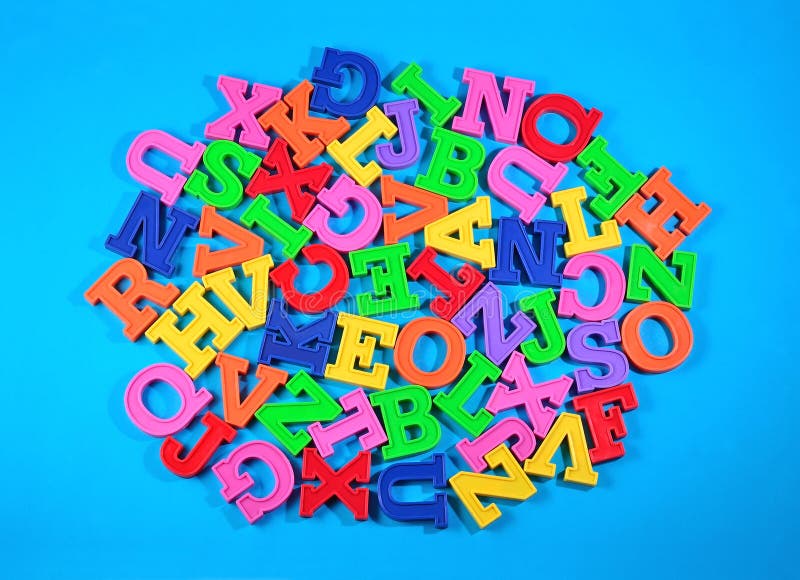 Heap of Plastic Colorful Alphabet Letters on a White Stock Image ...