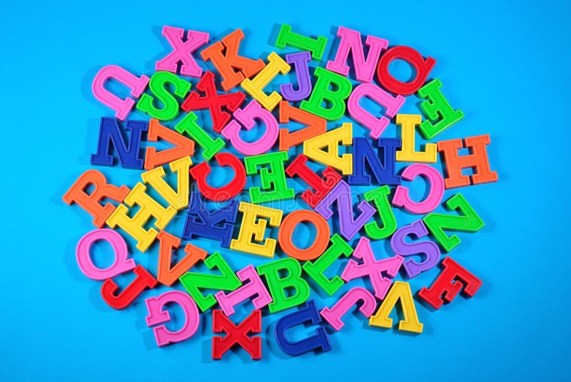 Heap of Plastic Colorful Alphabet Letters on a White Stock Image ...