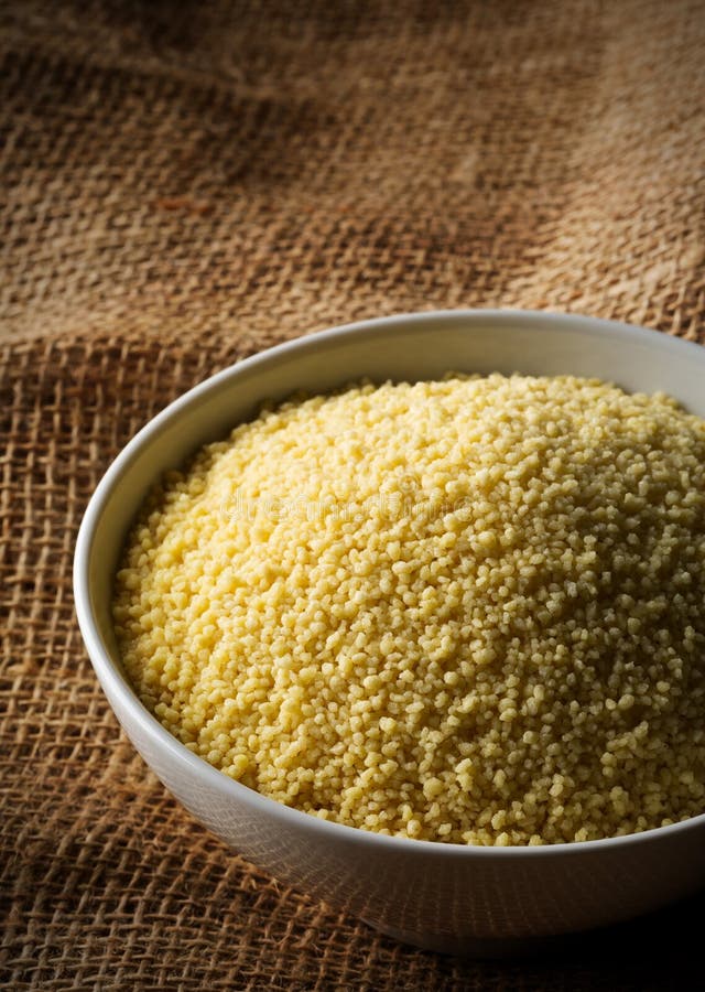 Heap of Raw, Uncooked Couscous in White Bowl on Burlap Stock Image ...