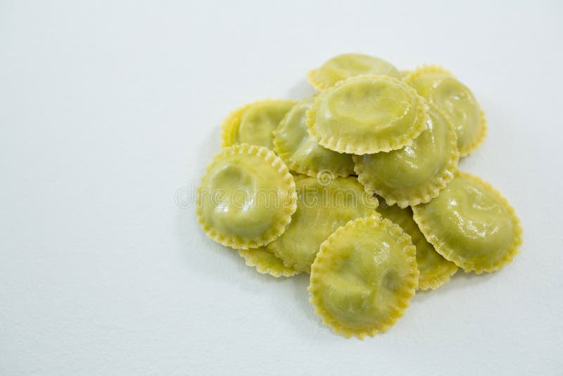 Round Ravioli Topped with Tomato Sauce Sprouts and Black Olive Stock ...