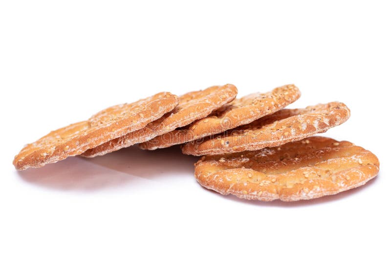 A Heap of Round Salt Crackers with Sesame Isolated on White Background ...