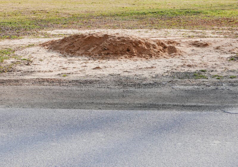 Heap of sand at the field stock photo. Image of heap - 114040300