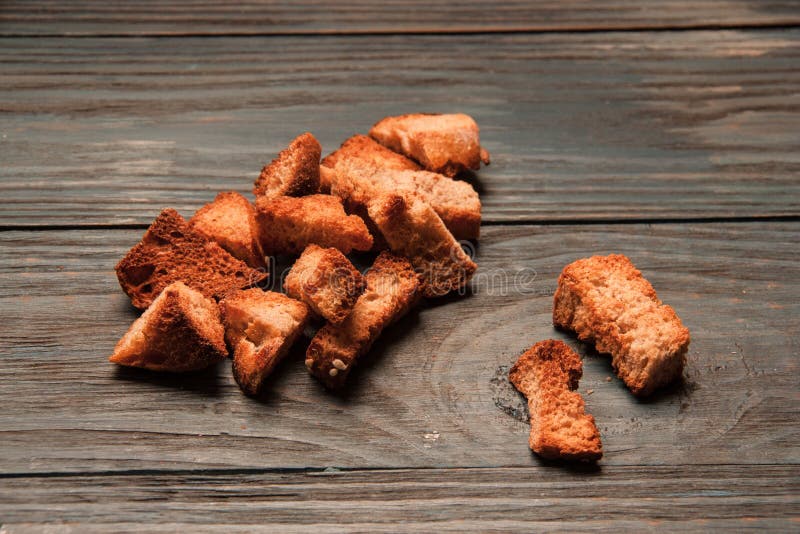 Heap of Small Rusks from Black Bread on a Rustic Wooden Table Stock ...