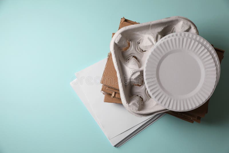 Heap of Waste Paper on Turquoise Background, Top View. Space for Text ...