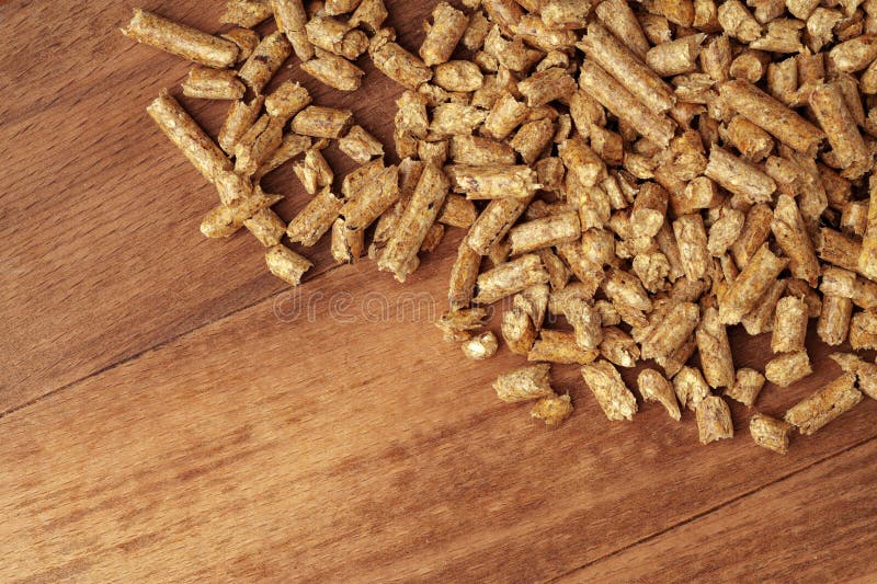 Heap of Wooden Pellets Biofuel on Wooden Table Close Up Stock Image ...