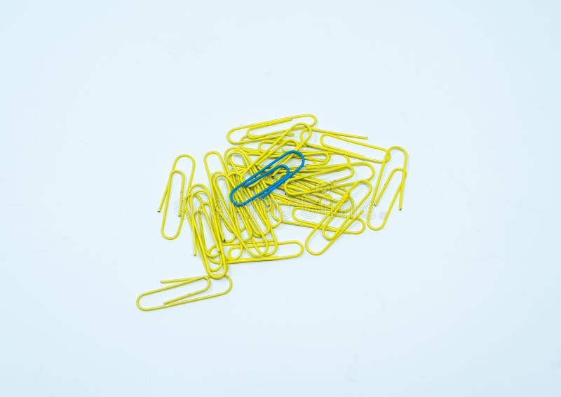 Heap of Yellow Paper Clips with Single Blue One Stock Image - Image of ...