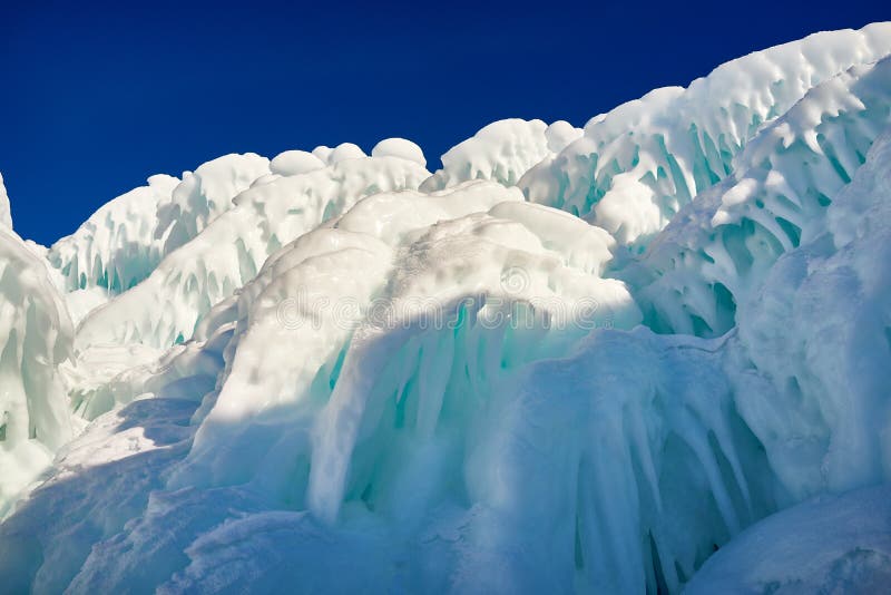 Heaps of Ice in the Form of Icicles on the Rocks. Stock Image - Image ...