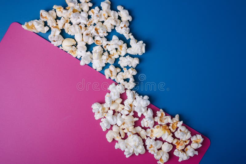 Heaps of Popcorn on Bright Pink and Blue Background. Top View, Copy ...