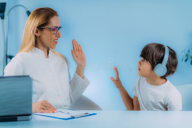 Hearing Test for Children. Audiologist Working with a Preschooler Boy ...