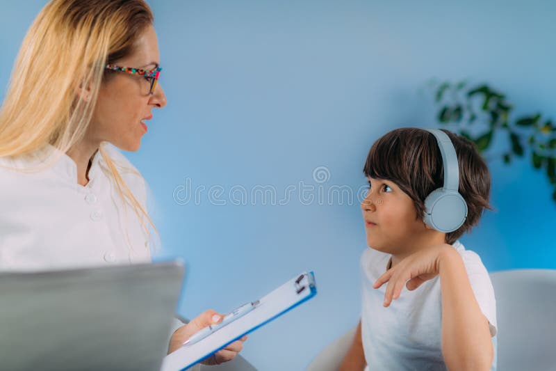 Hearing Test for Children. Audiologist Working with a Preschooler Boy ...