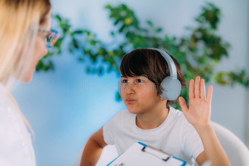 Hearing Test for Children. Audiologist Working with a Preschooler Boy ...