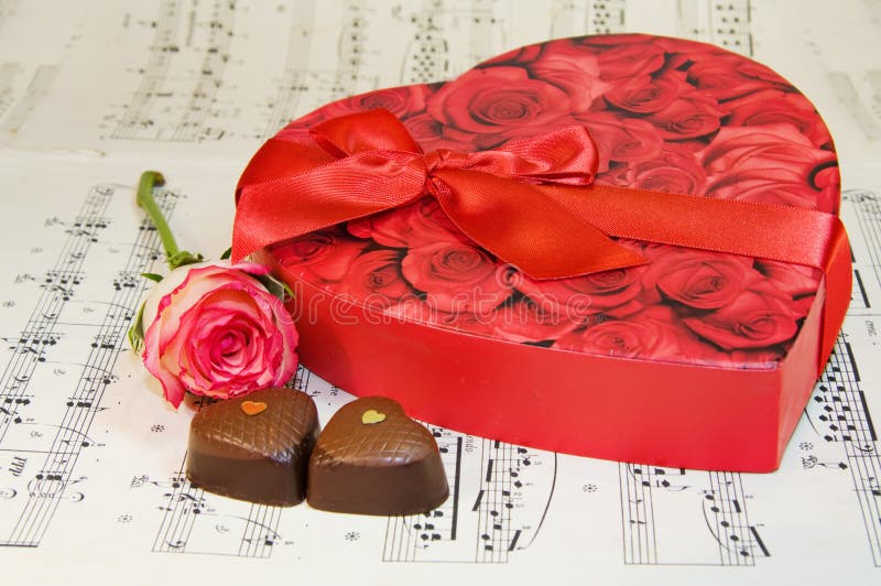 Heart Box of Chocolates with Rose Over Music Notes Stock Image - Image ...