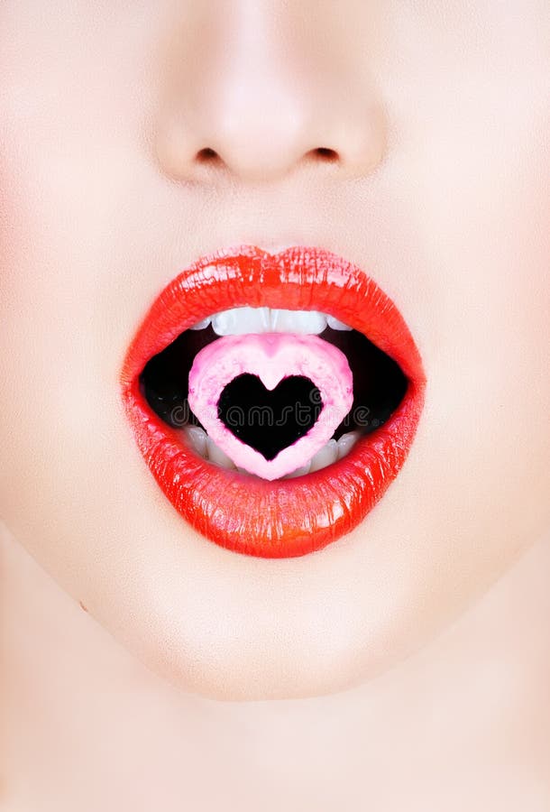 Heart Candy in Red Lips..Heart Candy in Red Lips. Stock Image - Image ...